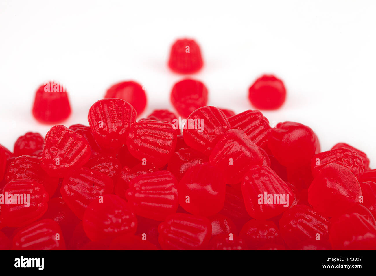 Pile of raspberry jelly candies isolated on white background Stock ...