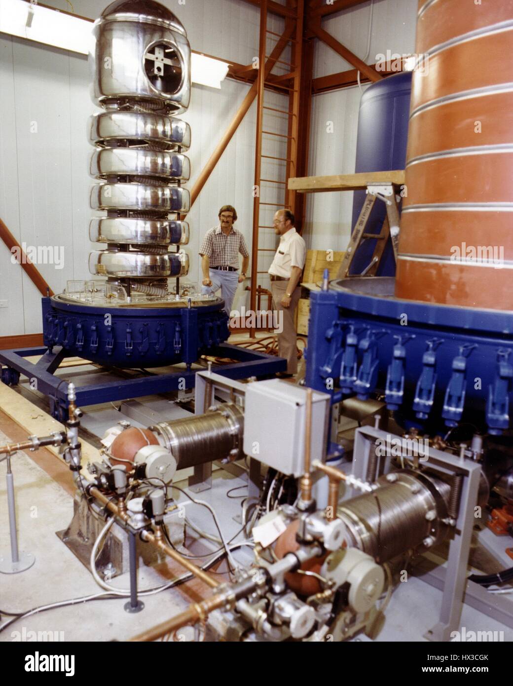Technicians view accelerator equipment at the National Center for ...
