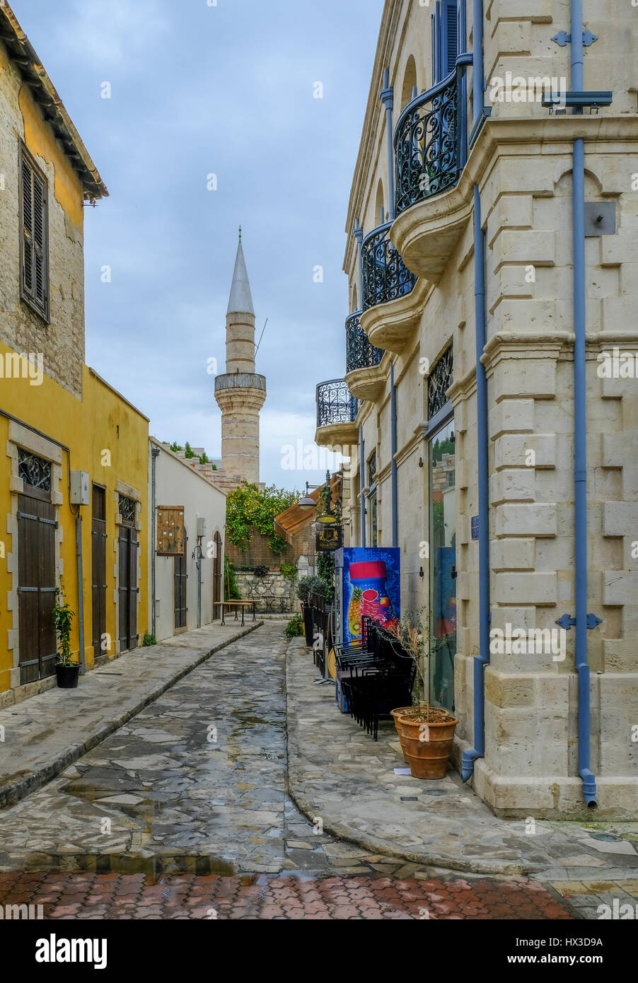 Limassol street scene with Mosque at the end. Shows the minaret and a ...