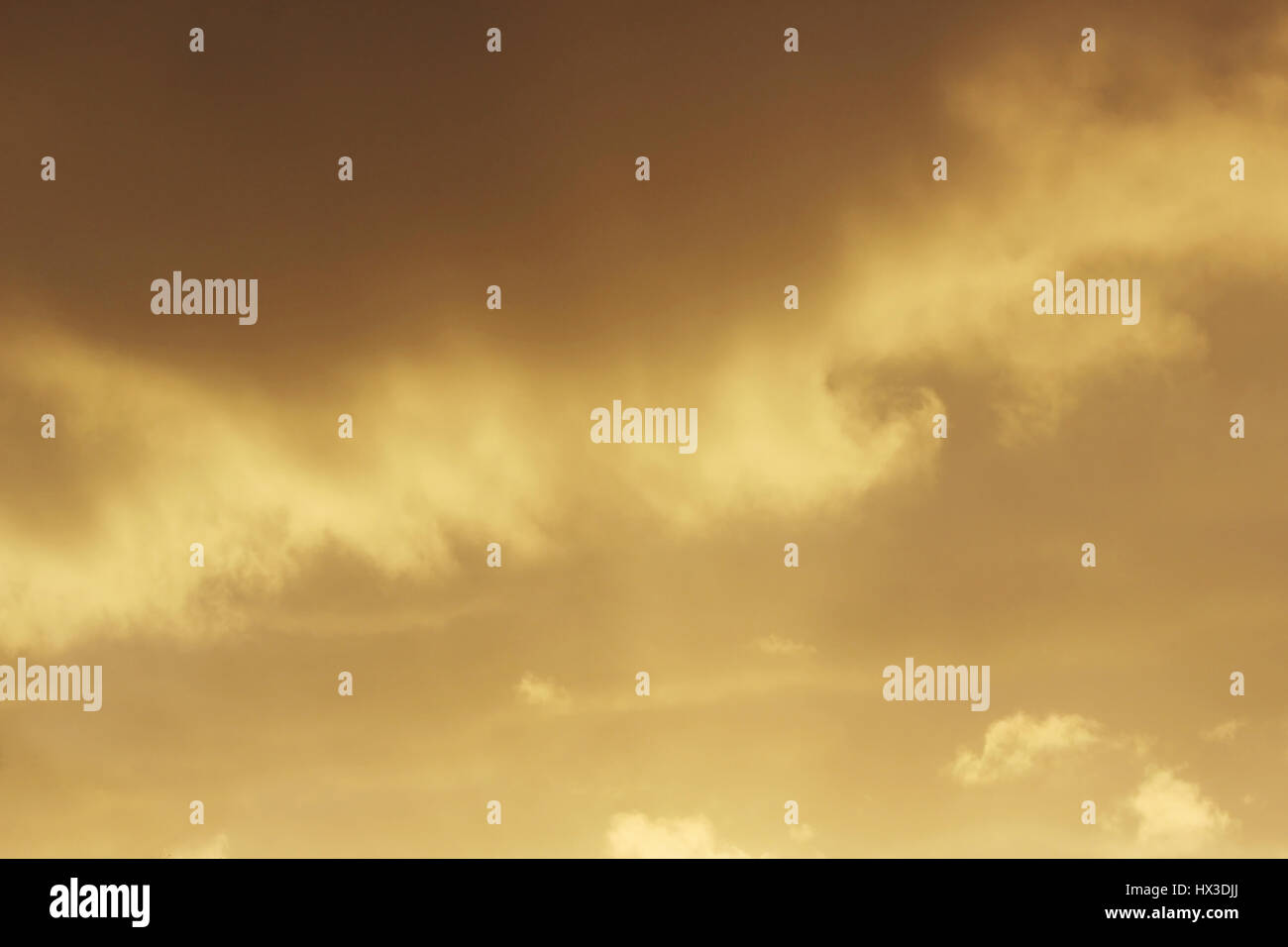 snow cloud painted in gold color of the setting of the spring sun Stock ...