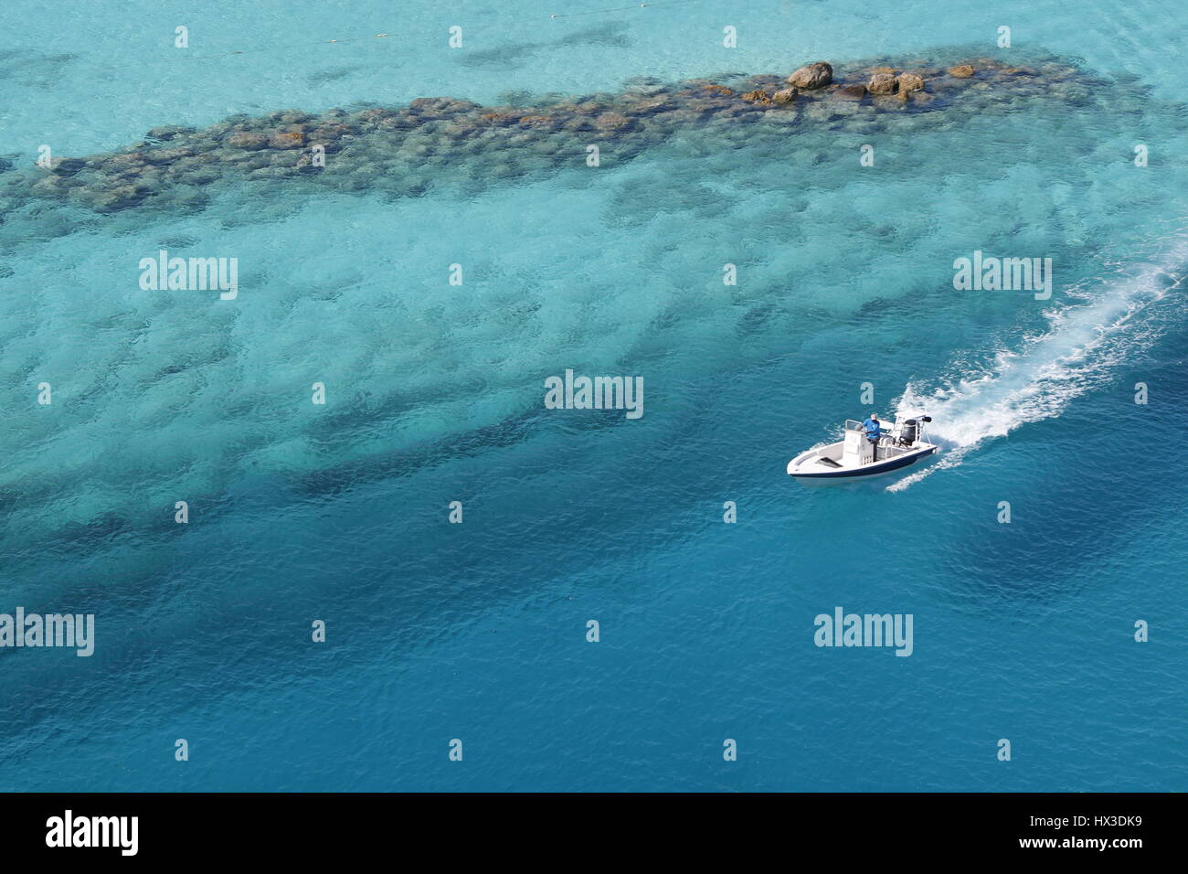Boating in the crystal clear waters of the Bahamas Stock Photo - Alamy
