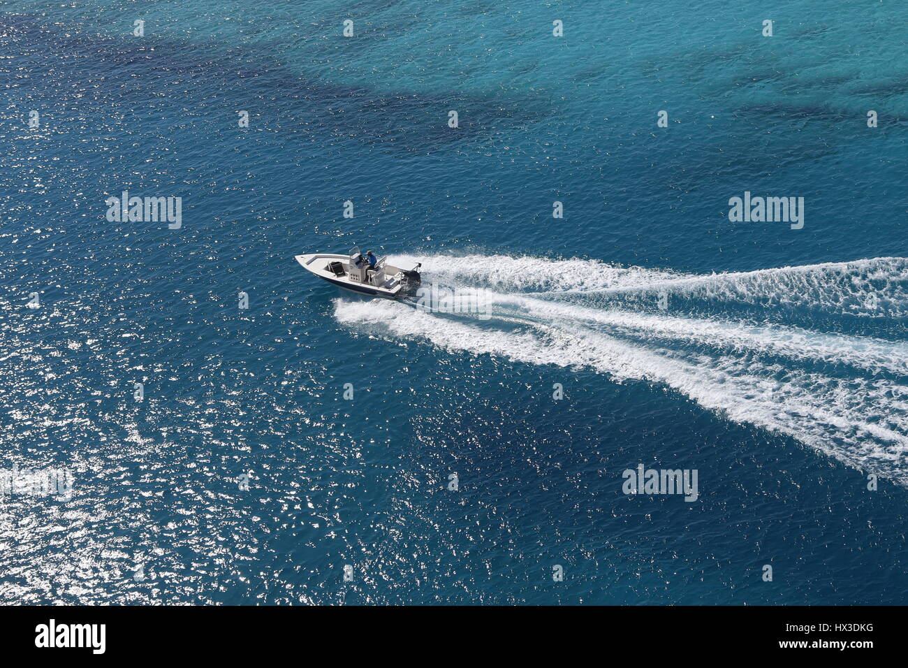 Boating in the crystal clear waters of the Bahamas Stock Photo - Alamy