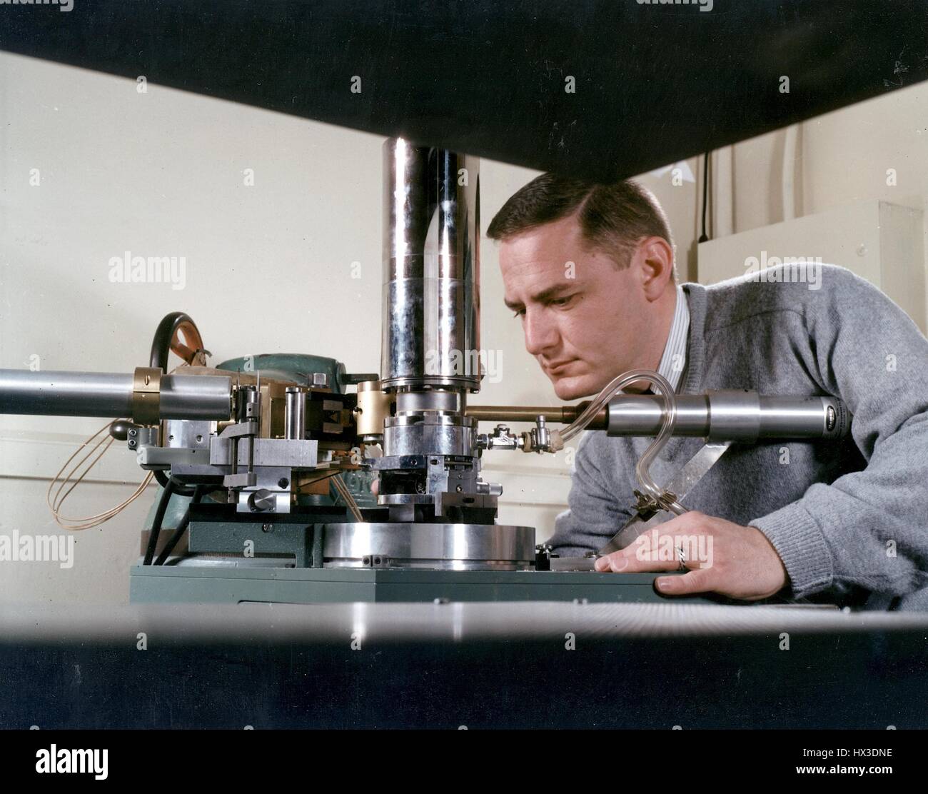 A researcher aligns a crystal of holmium in an x-ray beam, 1967. Image ...
