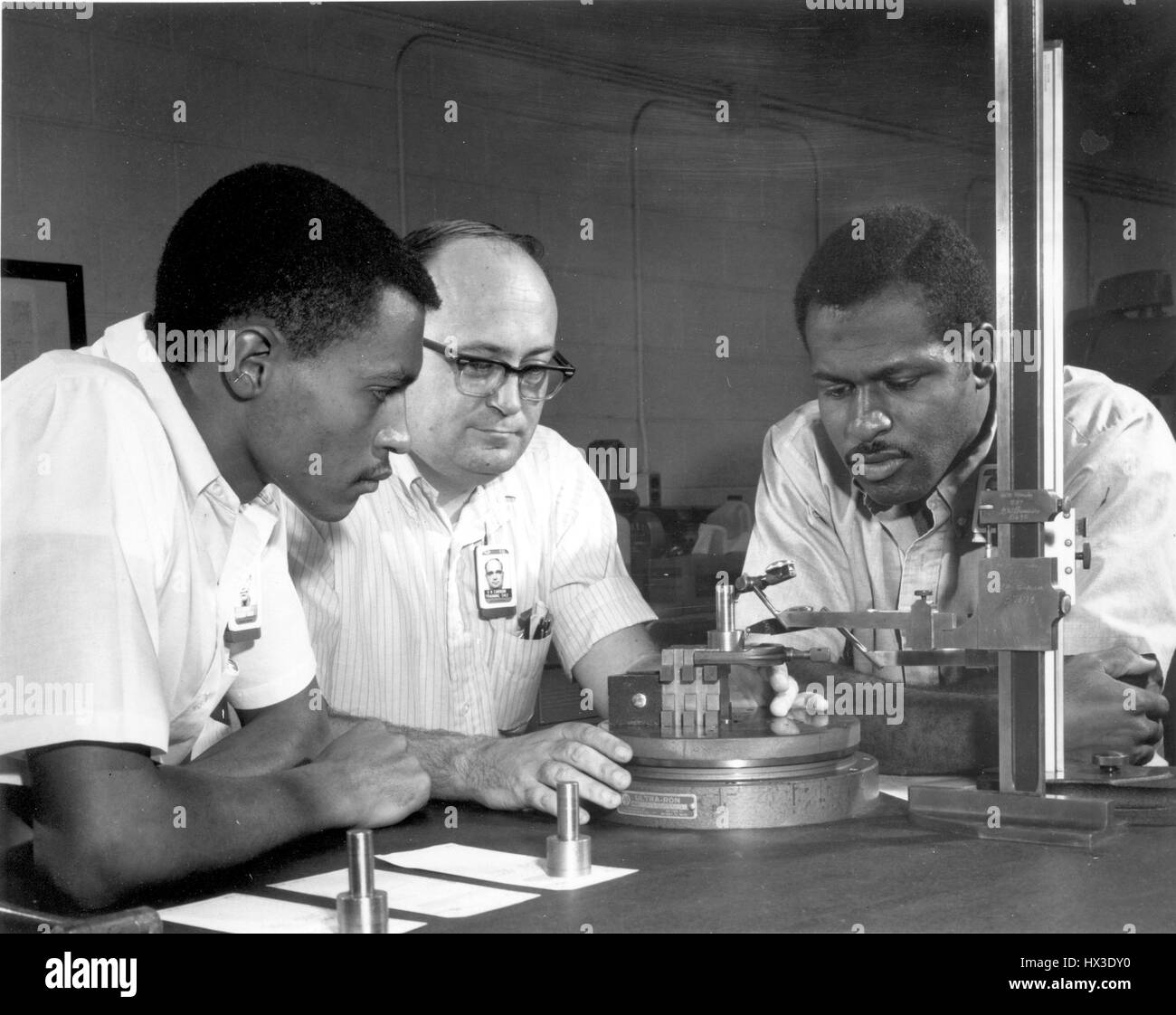 Students check the quality of a machine in an inspection laboratory ...