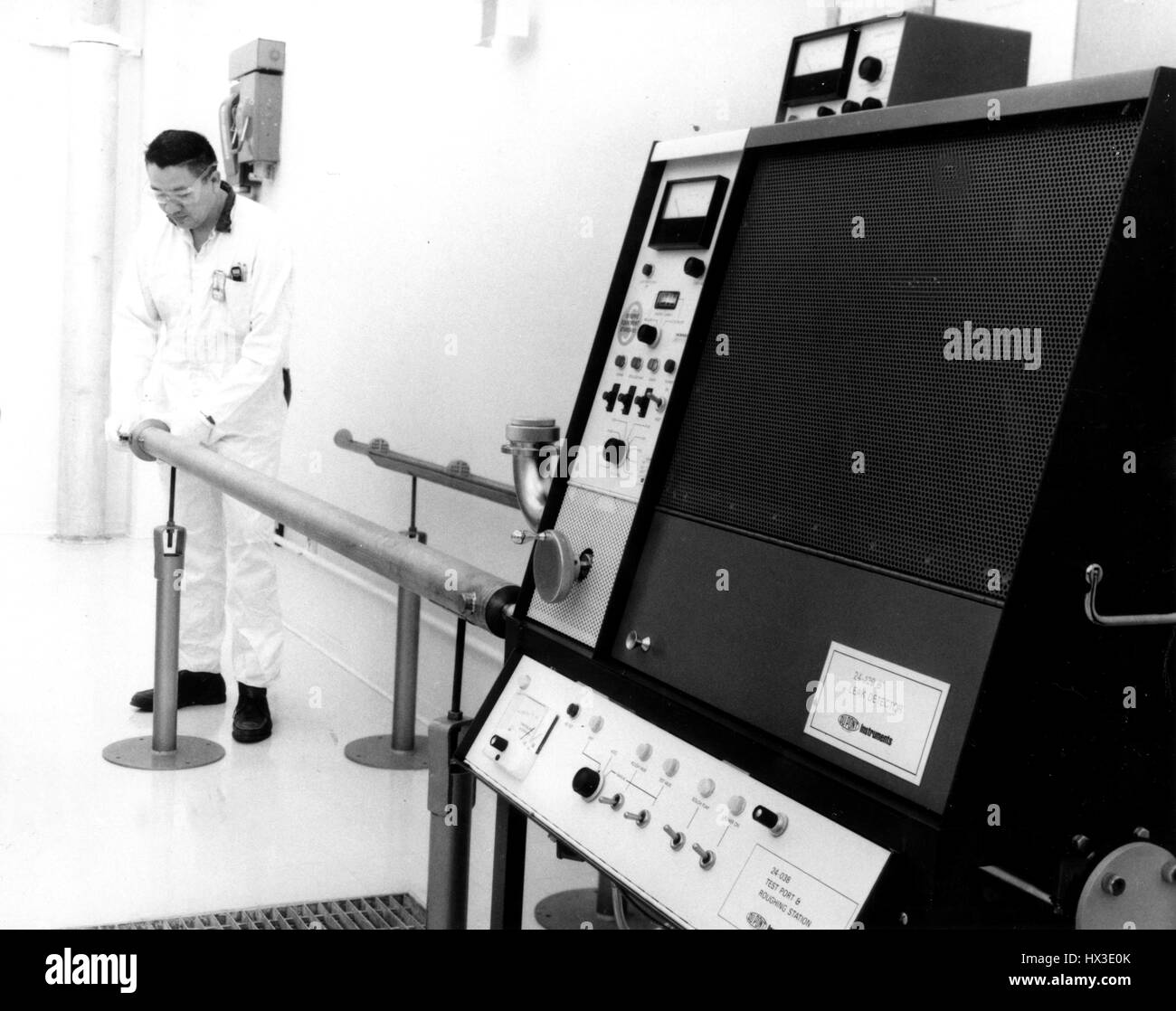 A worker tests weld integrity of every 94-inch long uranium-plutonium ...