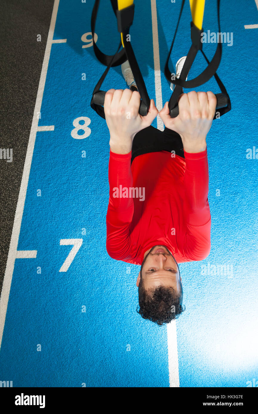 One young handsome brave curly bearded muscled man with a beard makes ...