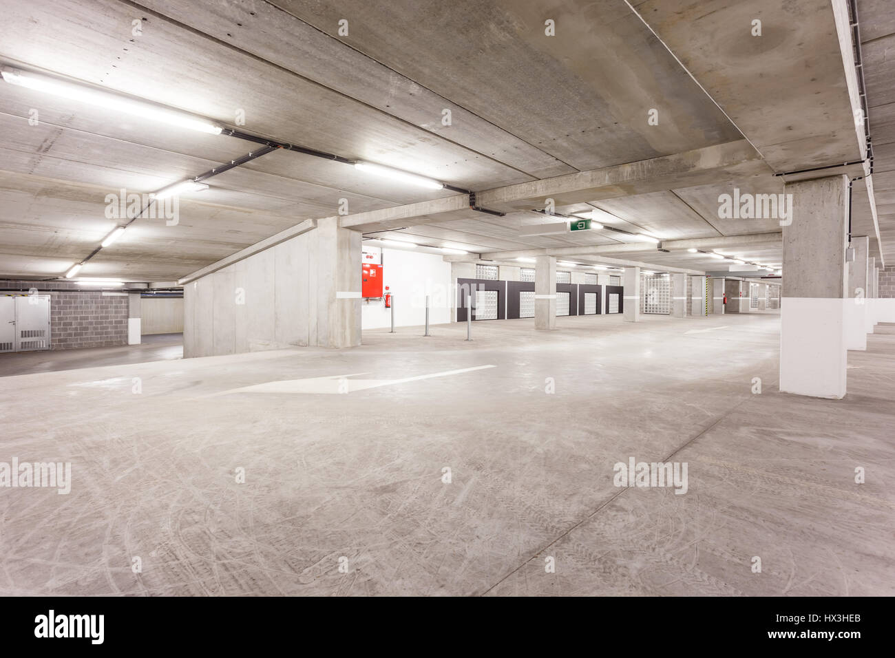 Underground park of a mall with columns and ventilation ducts Stock ...