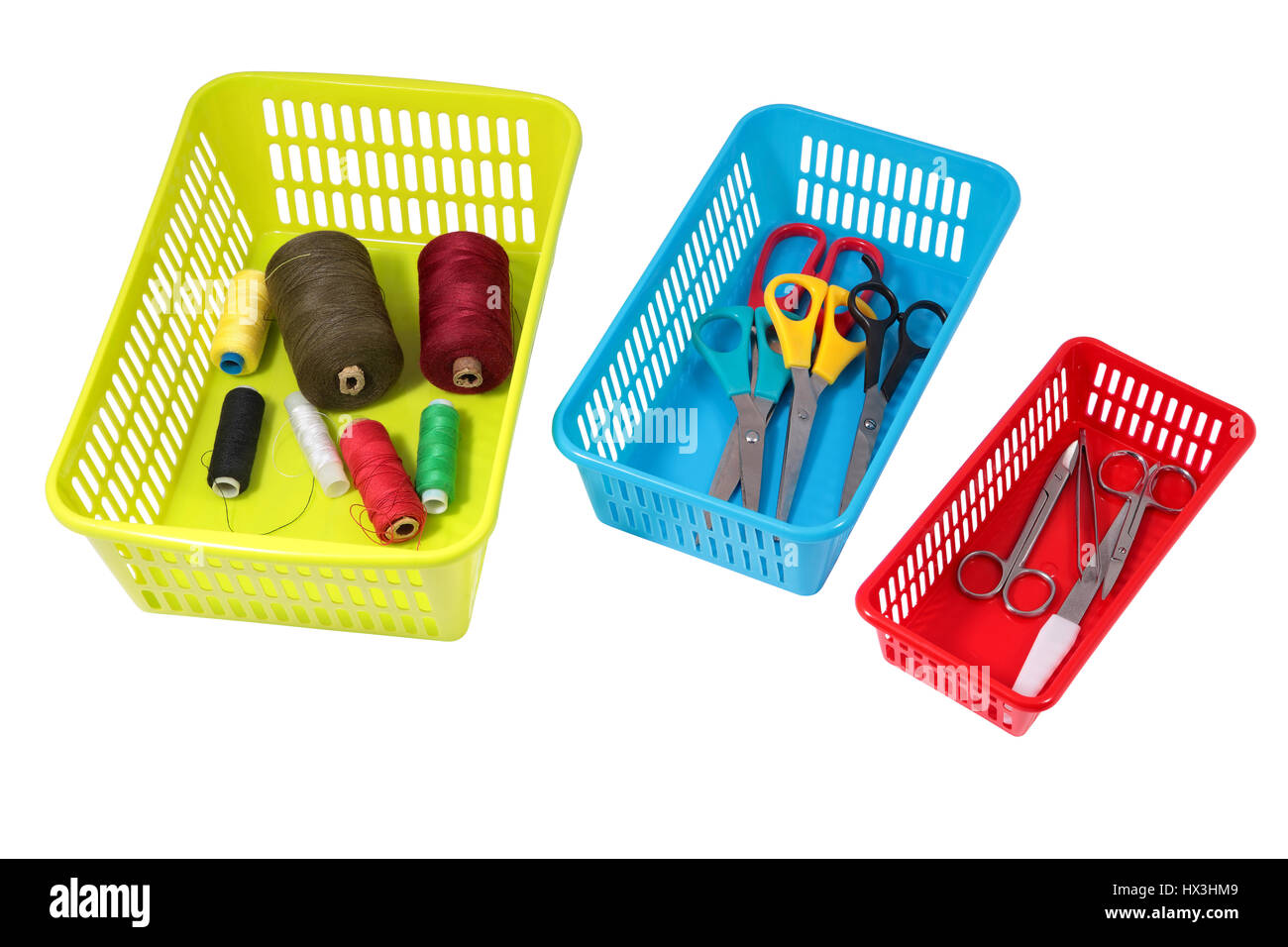 Colorful plastic baskets of different sizes for storing household tools ...