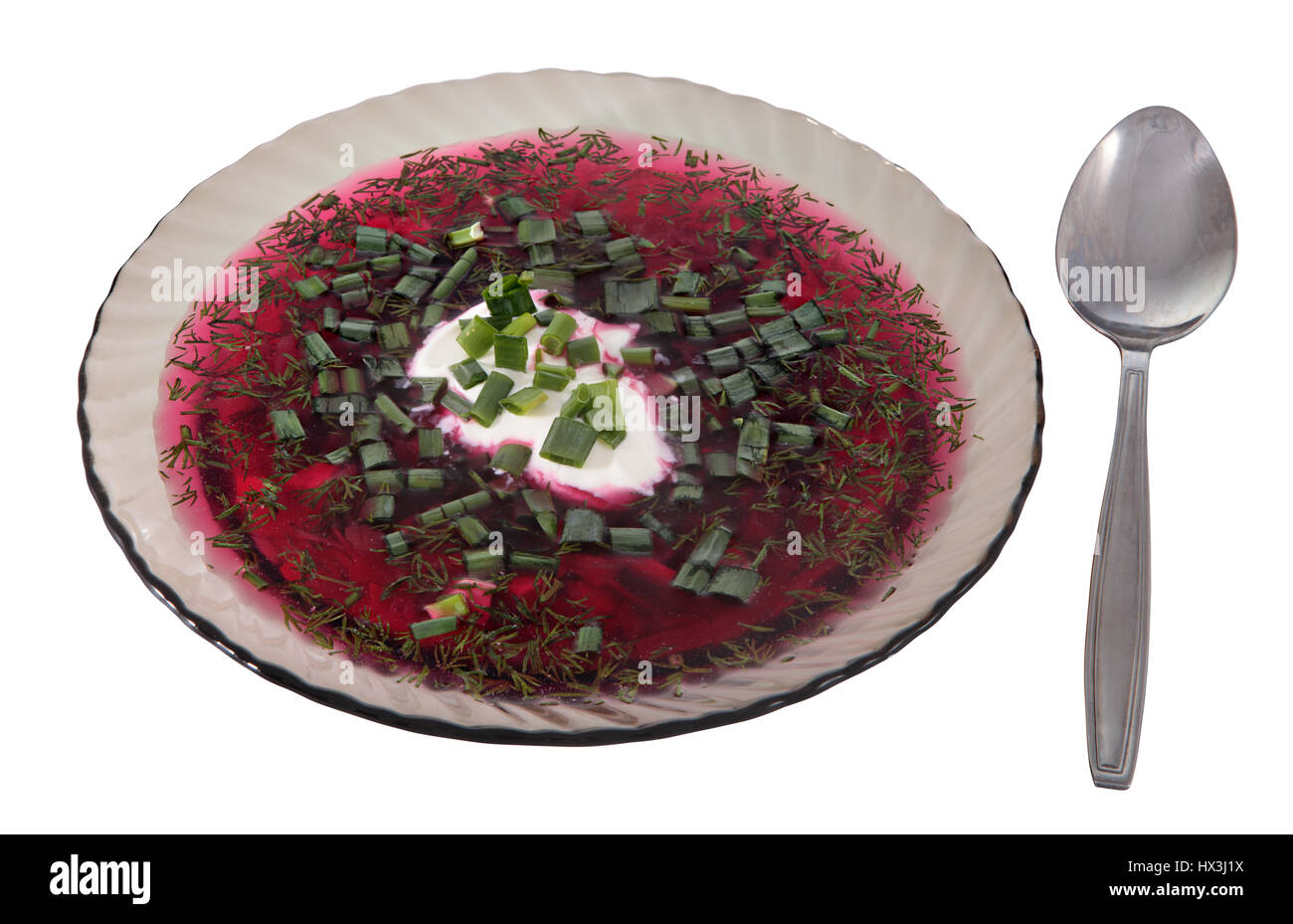 Plate of transparent glass dark, cold beetroot soup, Russian borscht ...