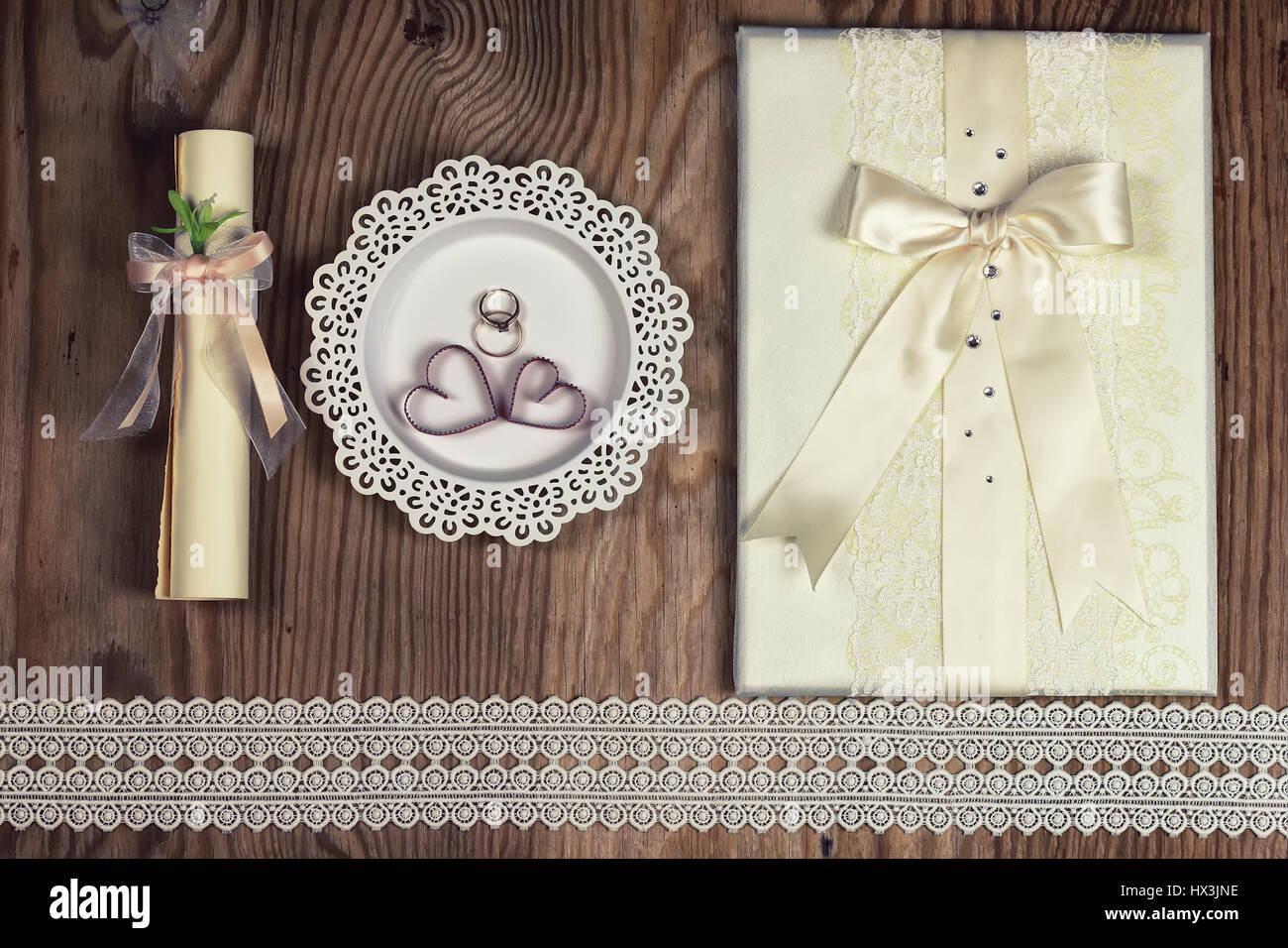 wedding ring invitation wood background Stock Photo - Alamy