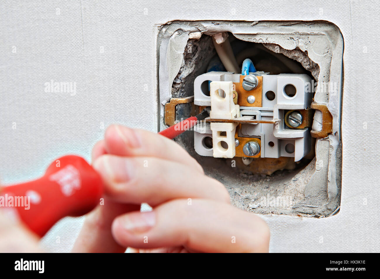 Replacing damaged switch hi-res stock photography and images - Alamy