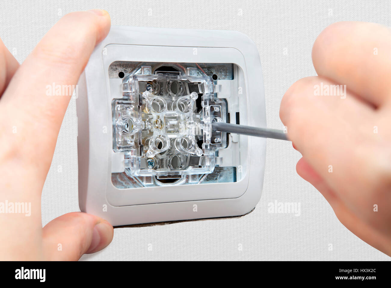 Installing the wall electric switch, close-up Stock Photo - Alamy