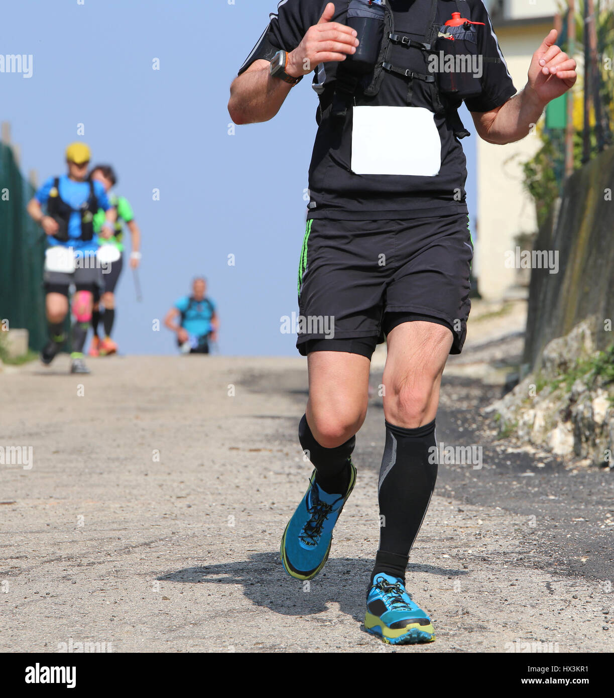 Runner with sportswear running fast during the cross-country race Stock ...