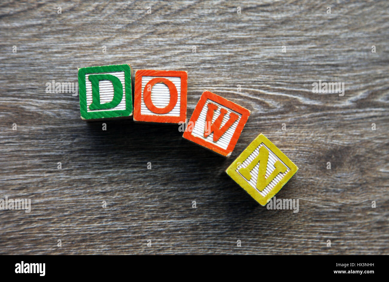 Word DOWN written with wood block letter alphabet Stock Photo - Alamy