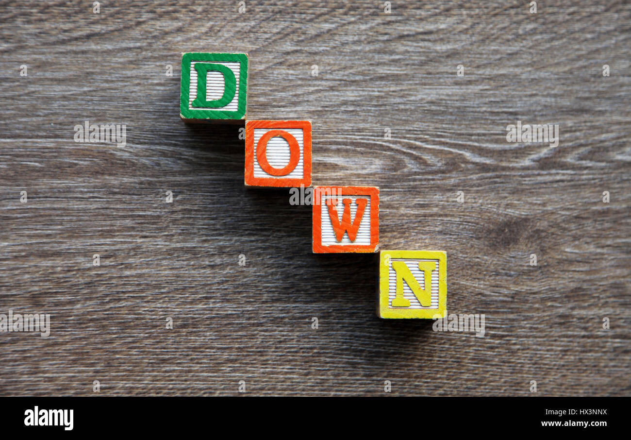 Word DOWN written with wood block letter alphabet Stock Photo - Alamy