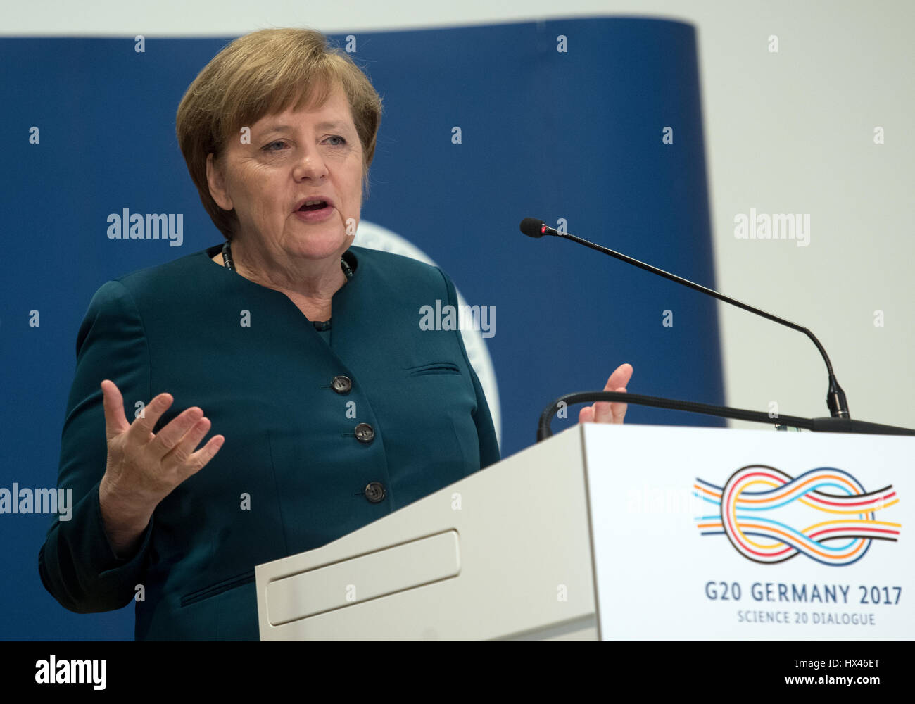 German Chancellor Angela Merkel speaks in front of members of the ...