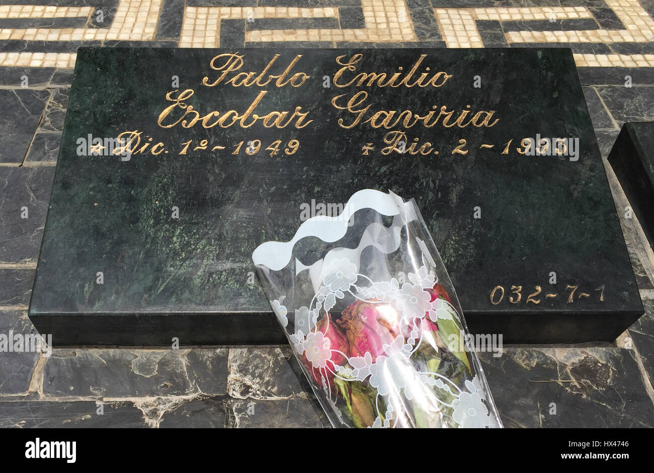 Flowers lie on Colombian drug boss Pablo Escobar's grave in Medellin ...