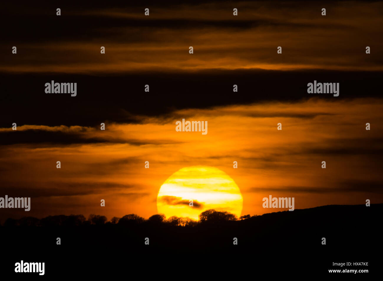 UK Weather: The sun setting over the hillside in Mid Wales. Credit: Ian ...