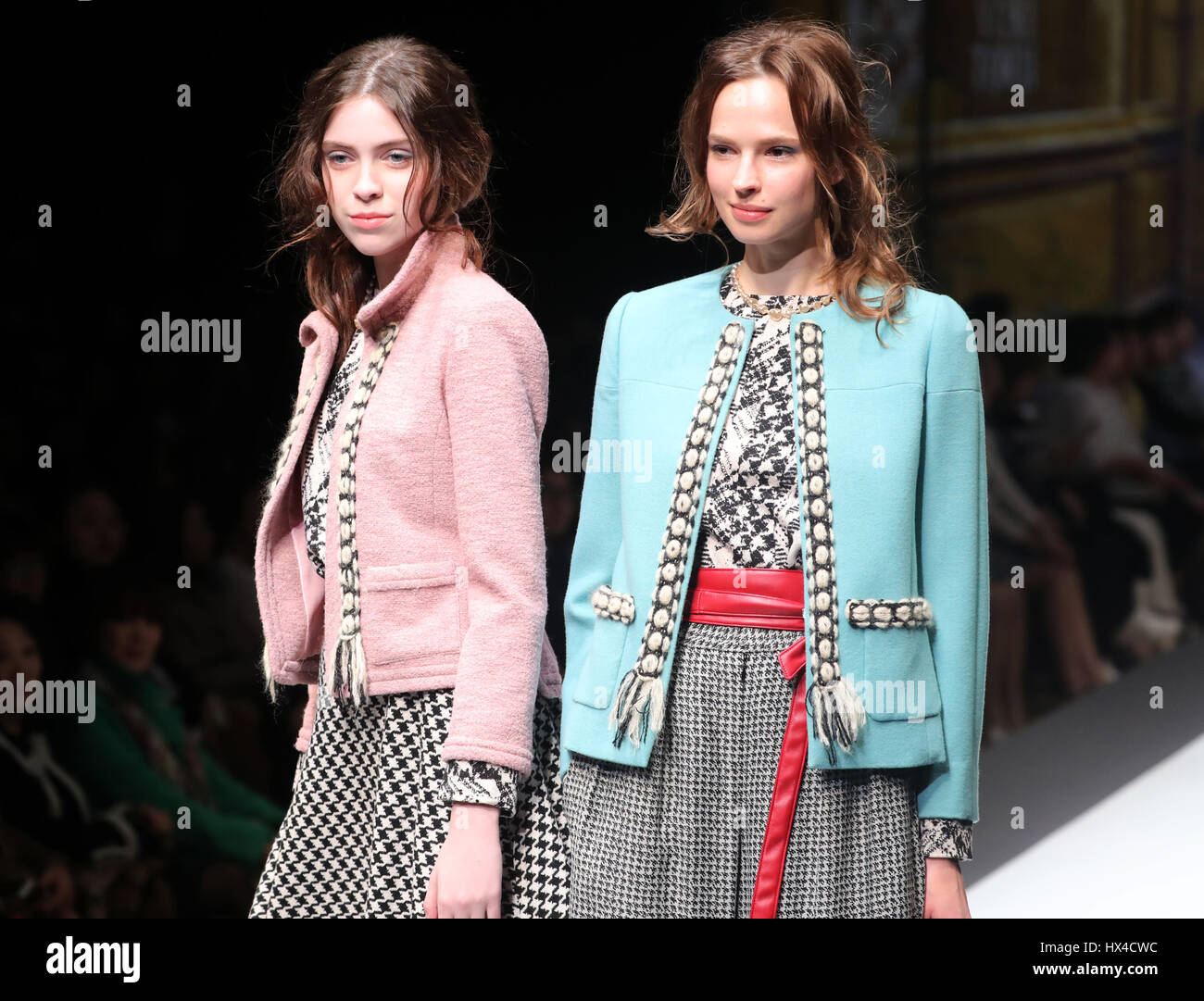 Tokyo, Japan. 24th Mar, 2017. Models display creations designded by ...