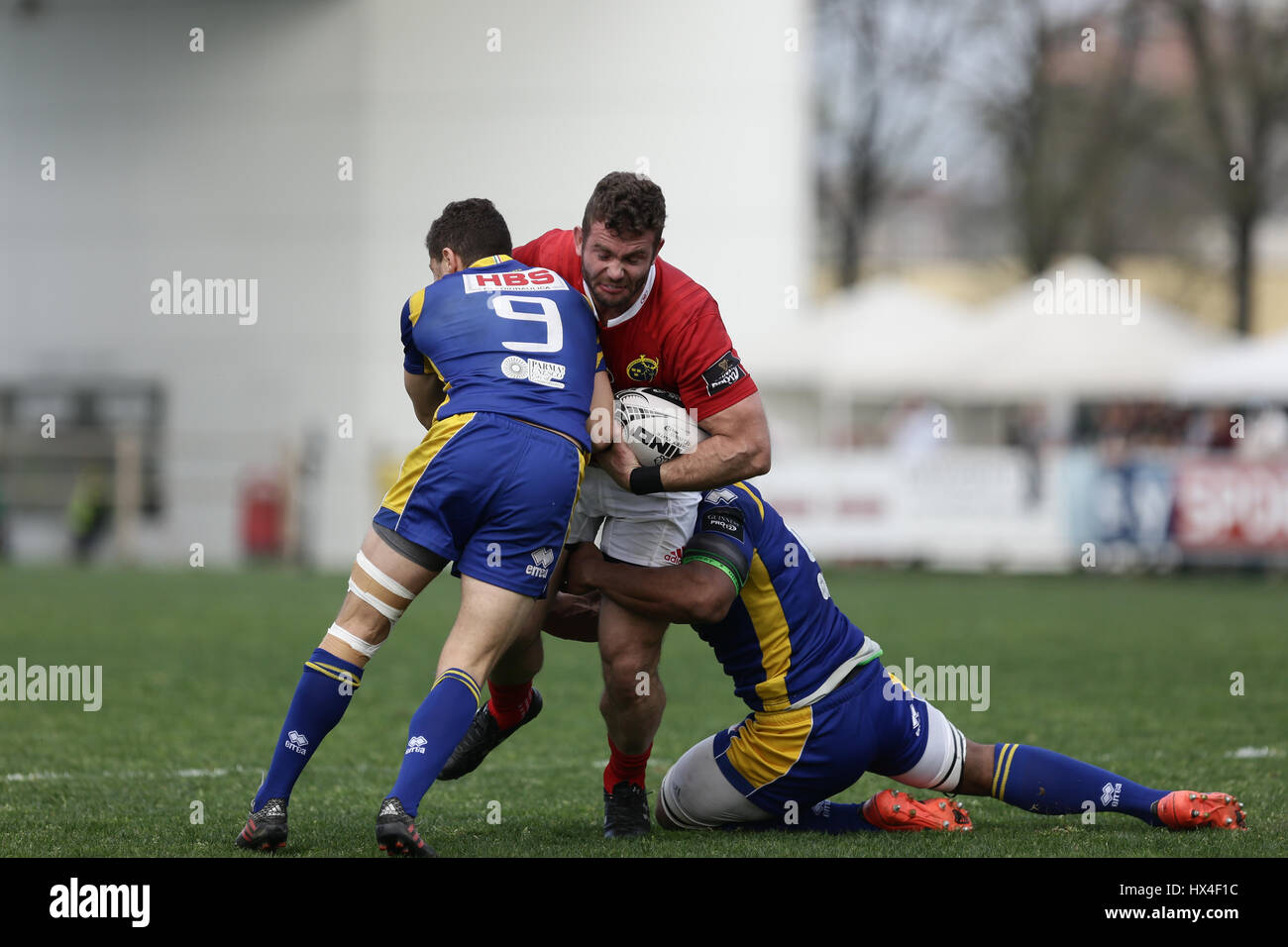 Parma,Italy.25th March, 2017.Munster's centre Jaco Taute tries to break ...