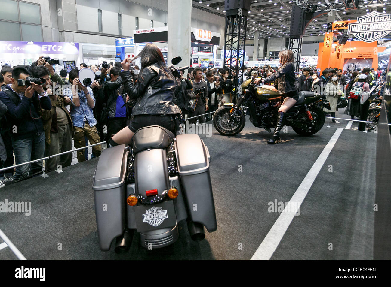 Booth assistants sit on Harley-Davidson new models Road King Special (L ...