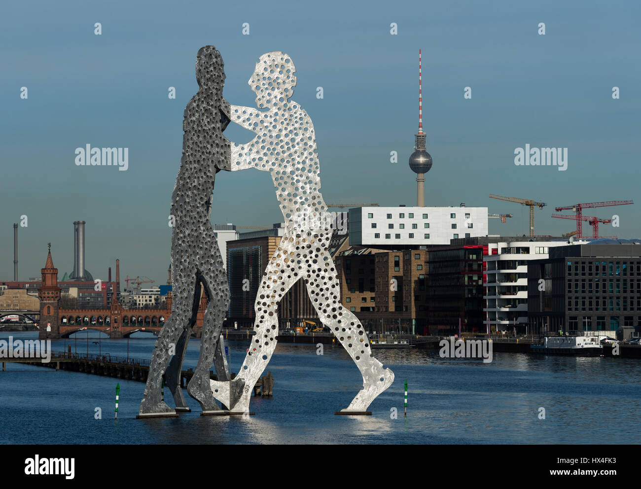 The sun glows on the Molecule Man Monument near Treptower Park in ...