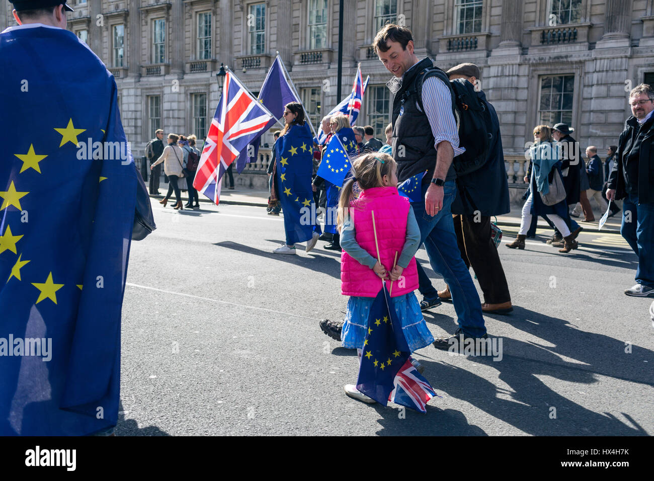 London, UK. 25th Mar, 2017. A young girl marching with her dad during ...