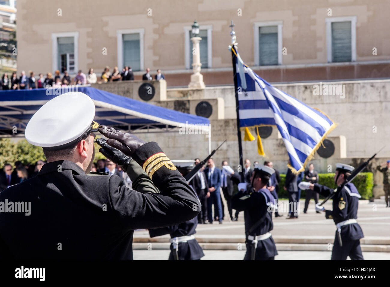 Athens, Greece. 25th Mar, 2017. A military official salutes as the ...