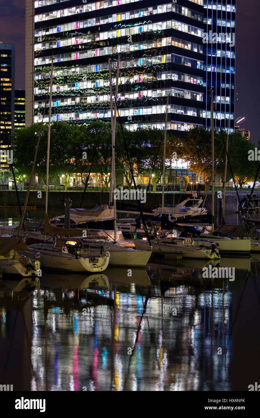 The Telecom building reflected in the waters of Puerto Madero. Buenos ...