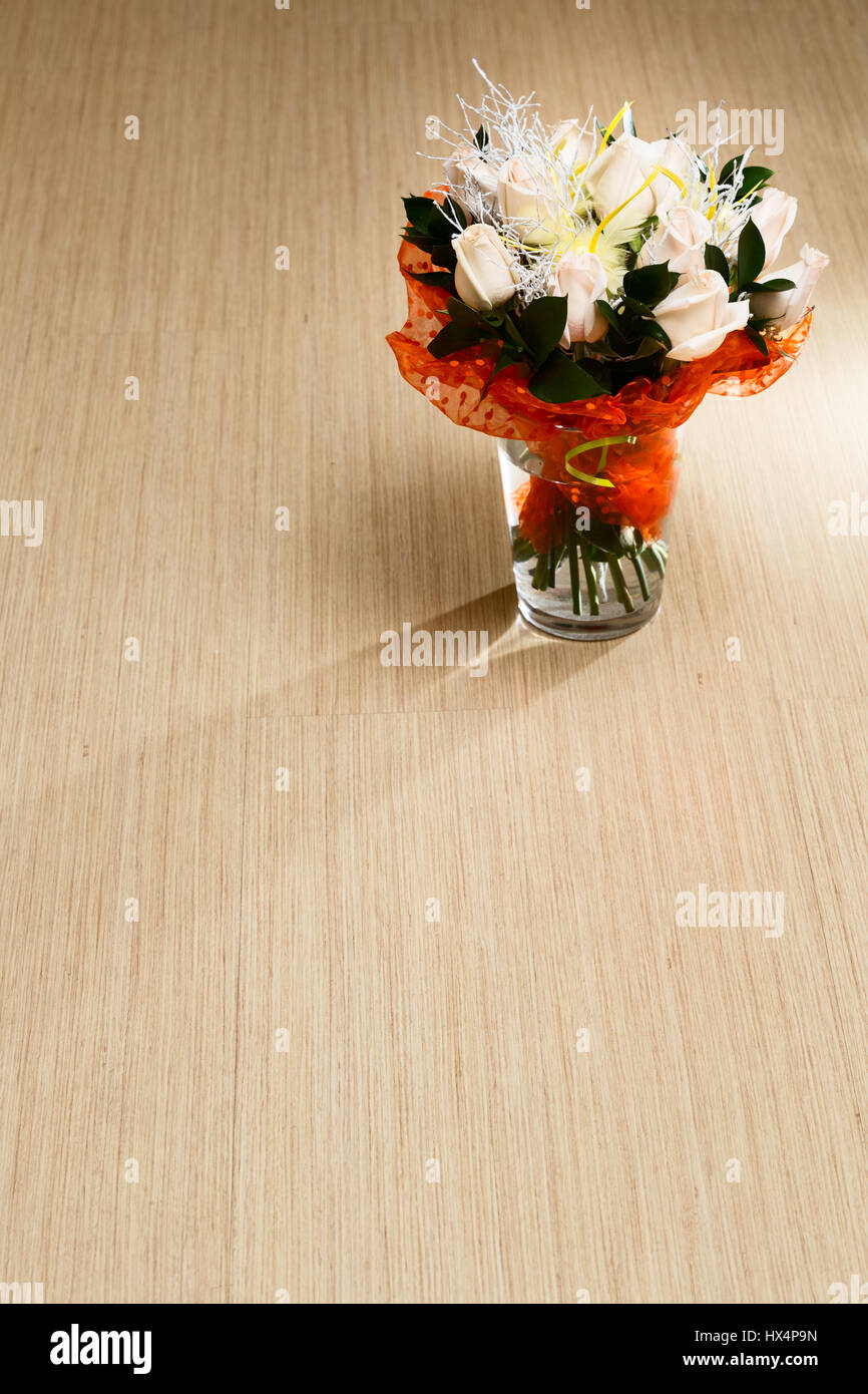 Bouquet of white roses on the wooden floor Stock Photo - Alamy