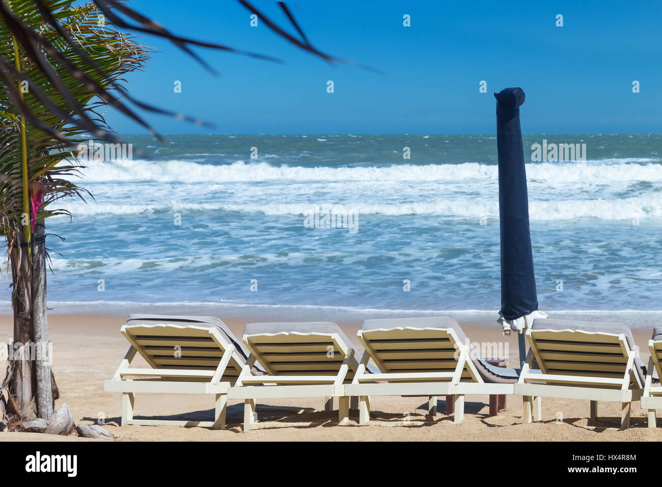 summer beach sun chairs lounger near perfect tropical sea Stock Photo ...