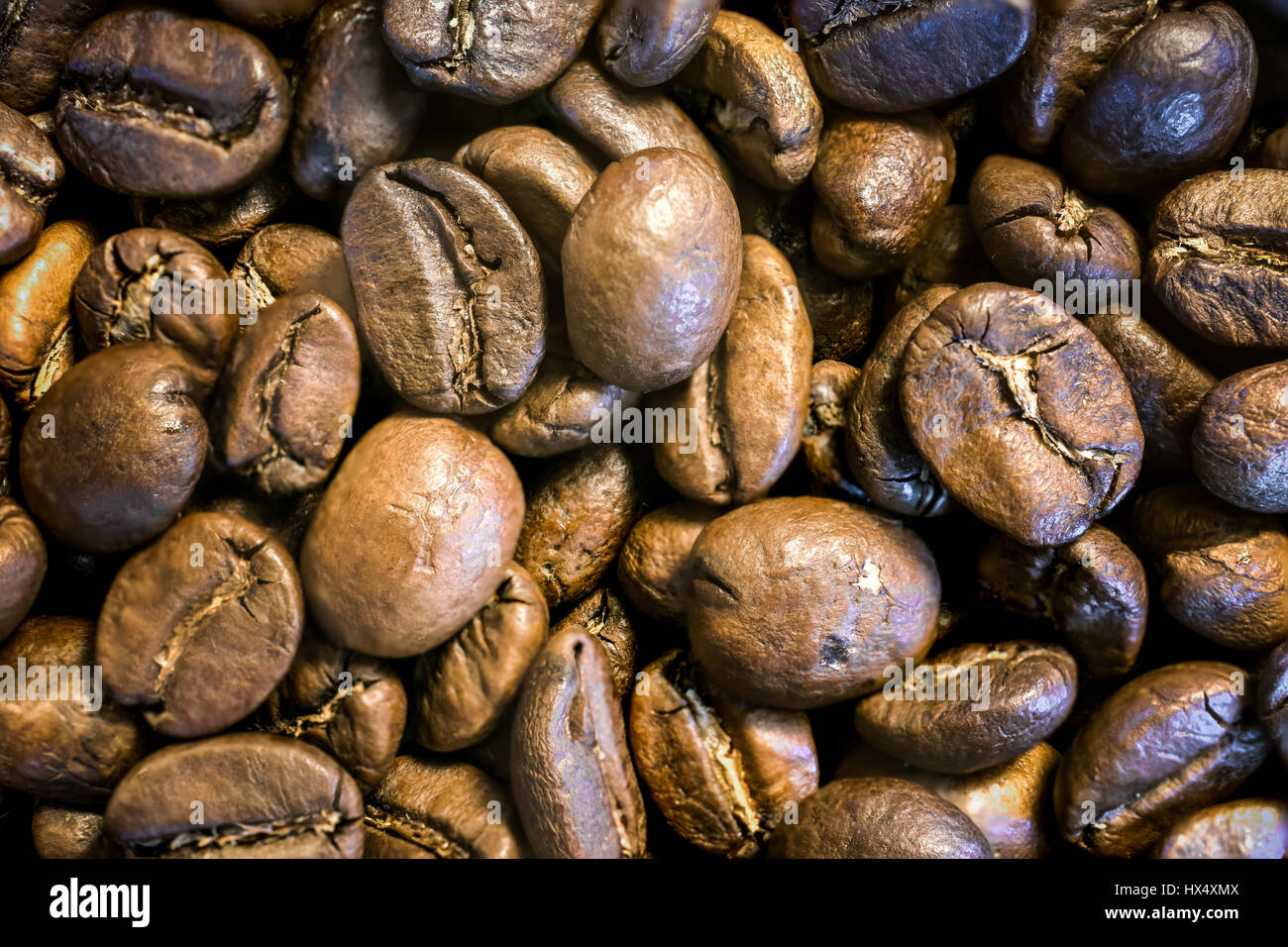 Whole Coffee Beans Up Close Stock Photo - Alamy