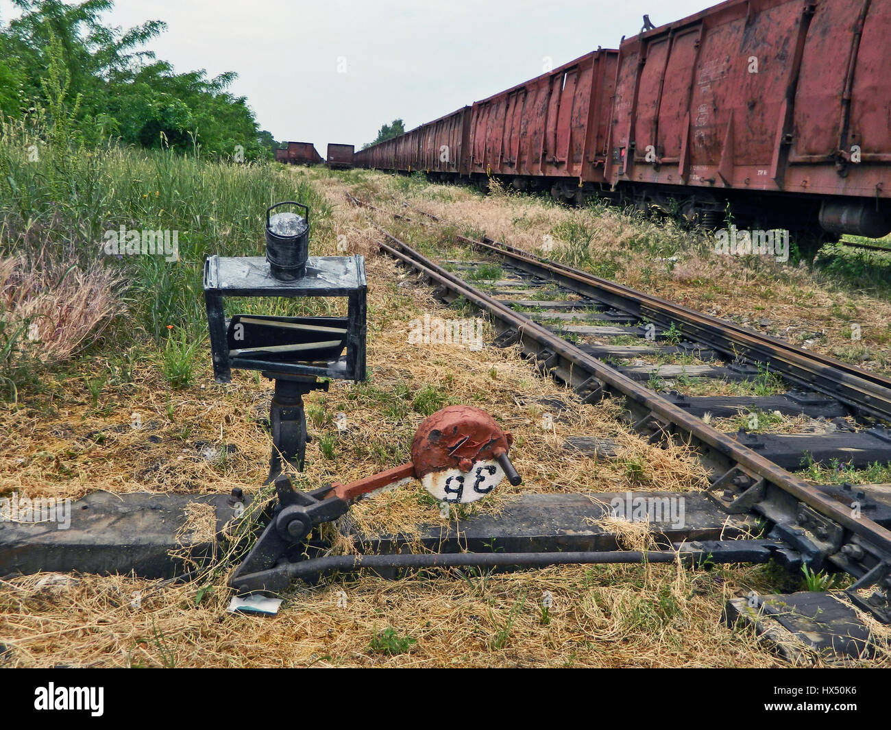 Old and damaged railway switch in the train station Stock Photo - Alamy