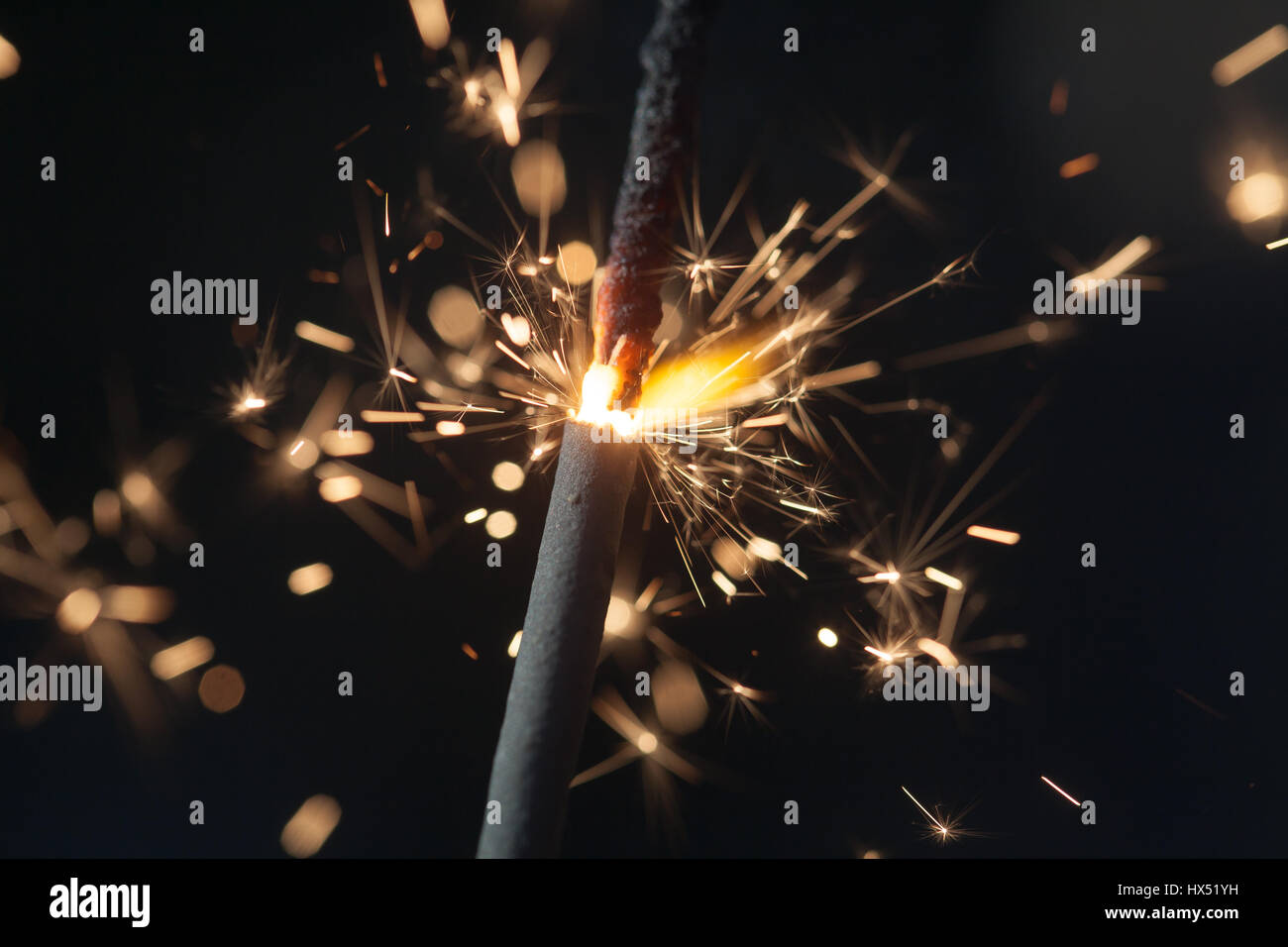 Sparkler burning and glowing in the dark Stock Photo - Alamy