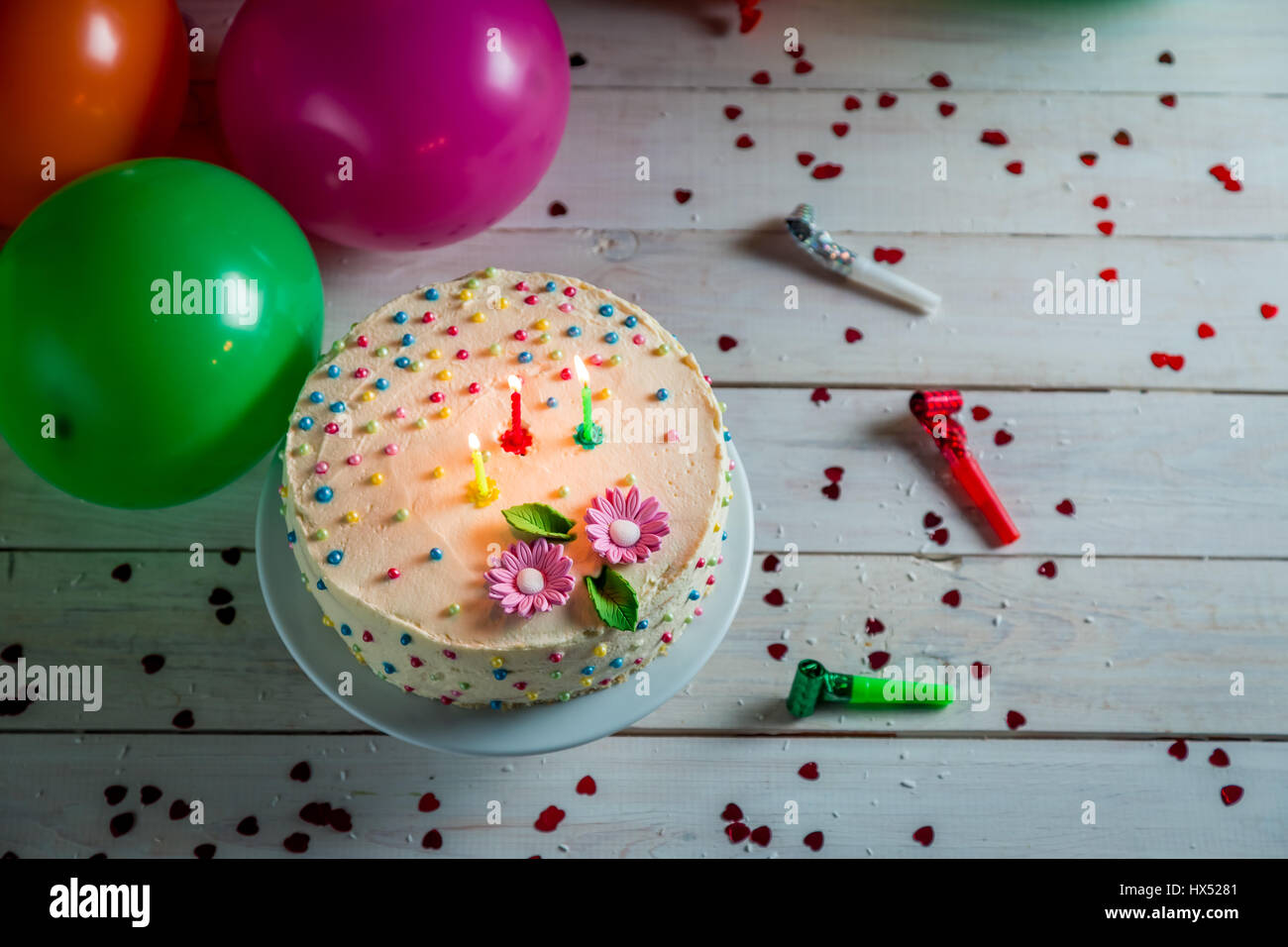 Time to blow out the candles from birthday cake Stock Photo - Alamy