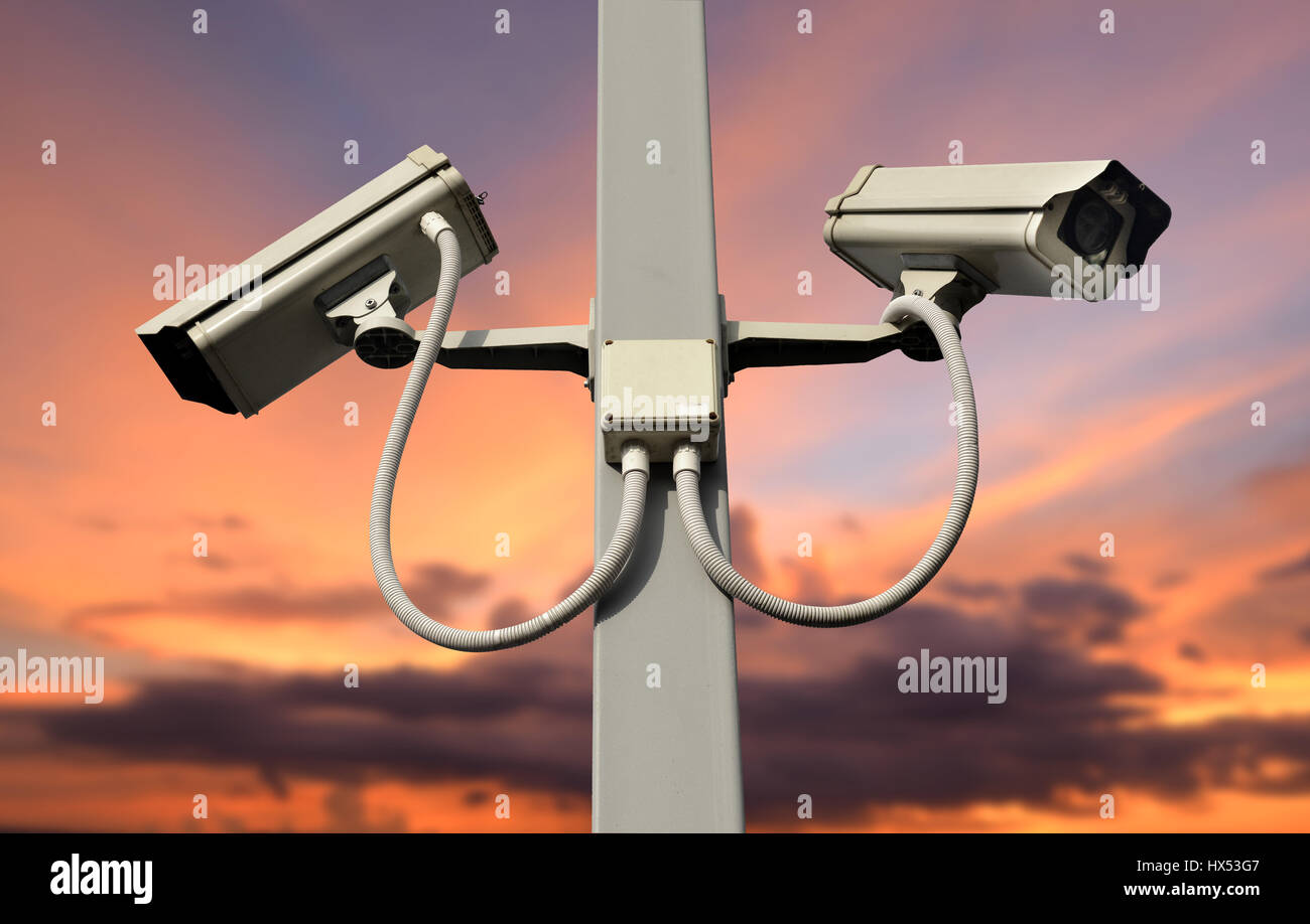 CCTV camera on the post with sunset sky background Stock Photo - Alamy