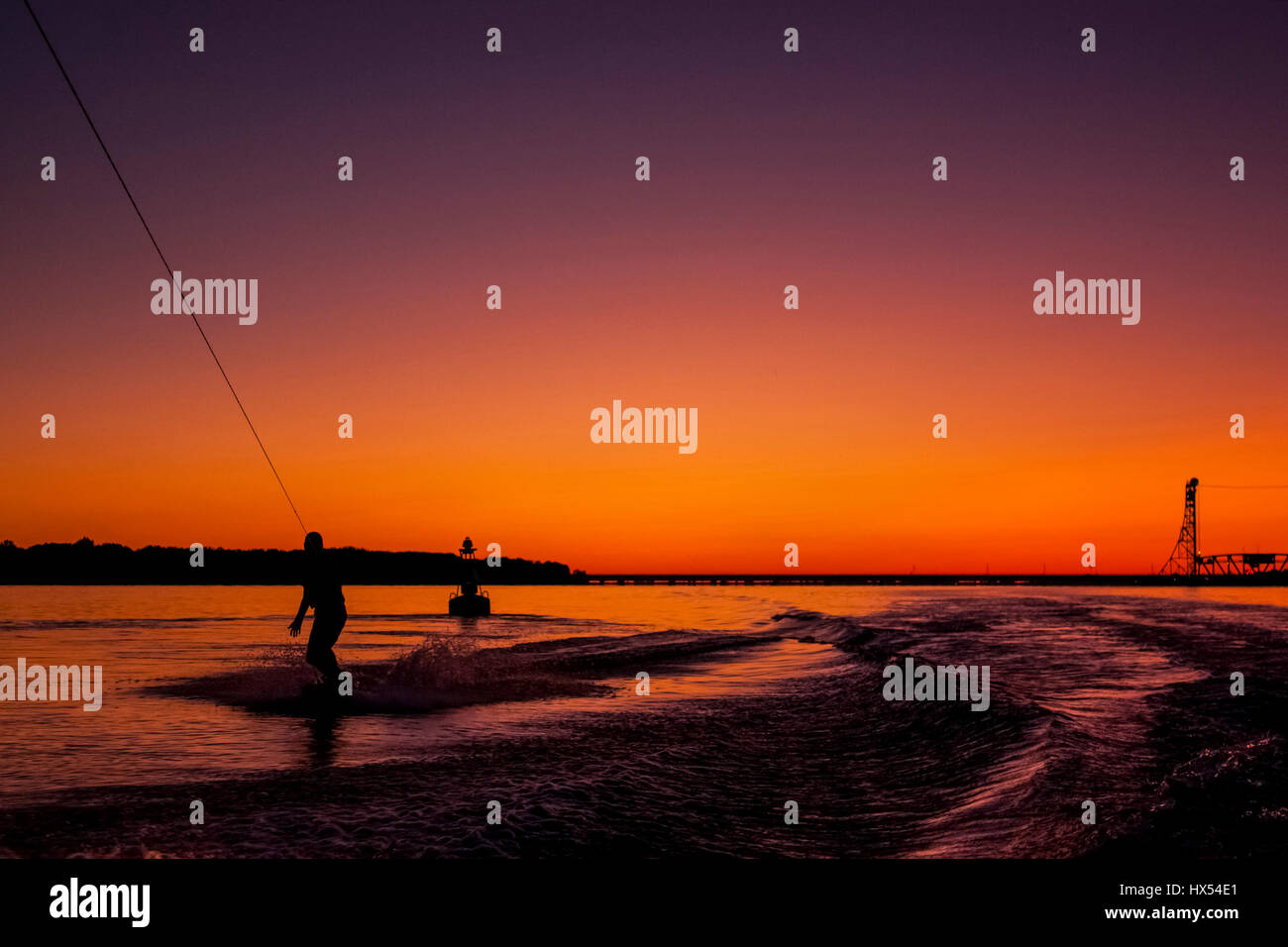 wakeboarding in the sunset Stock Photo - Alamy