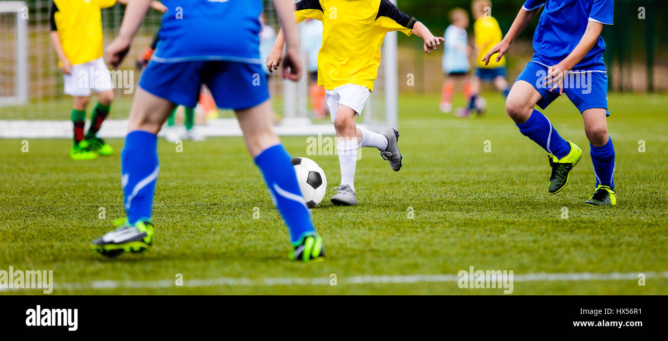 Football Player Running with the Ball on the Pitch. Footballers Kicking ...