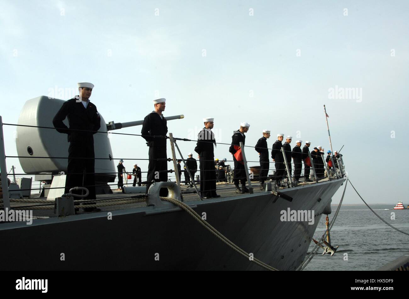 Sailors prepare to get underway aboard the guided-missile destroyer USS ...