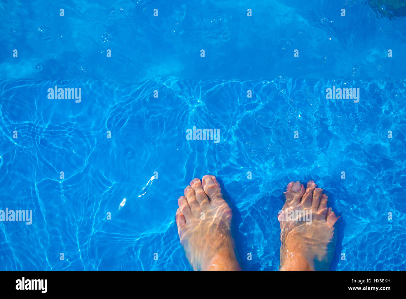 Human feet and swimming pool hi-res stock photography and images - Alamy