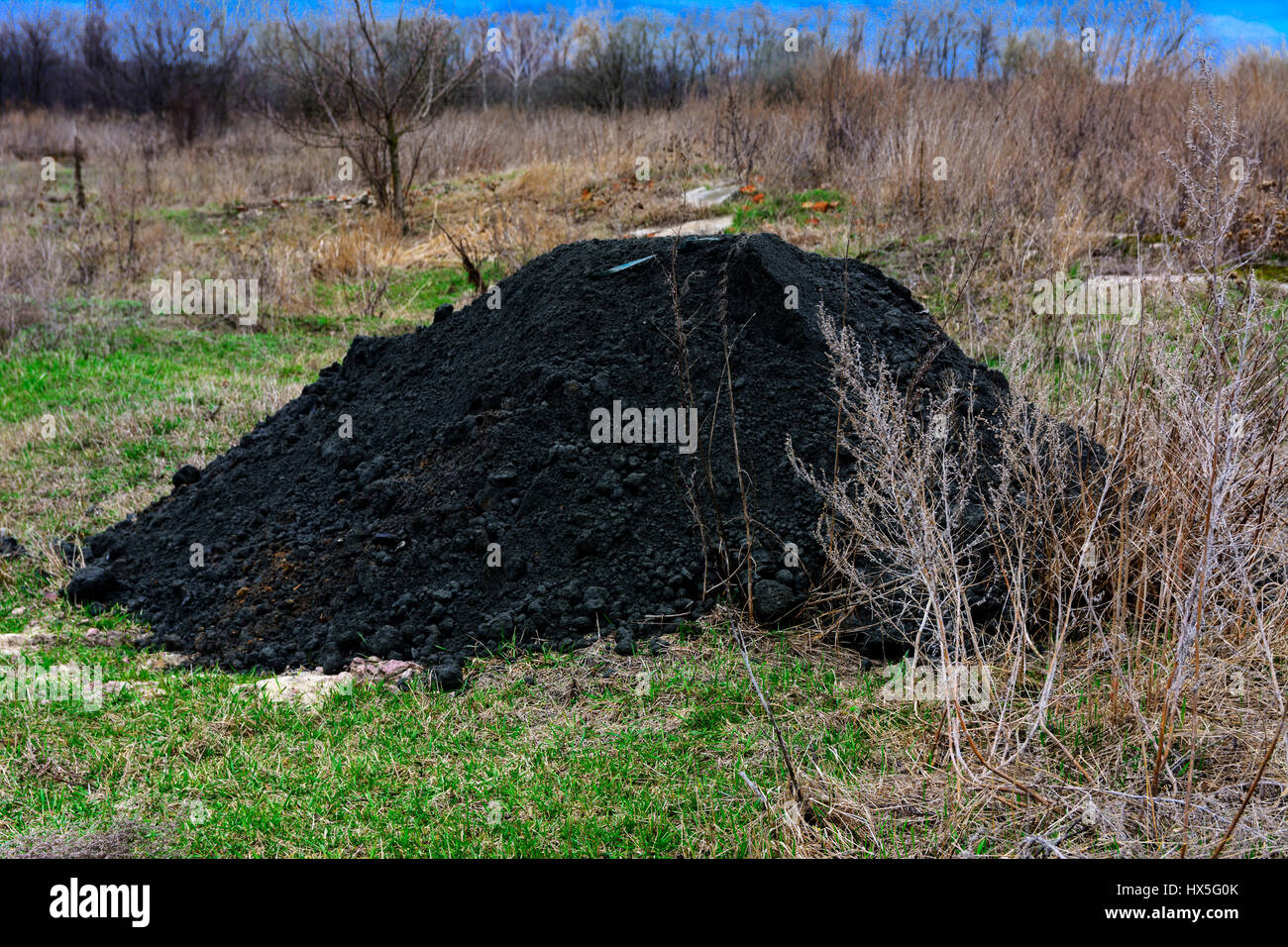 Pile of pulp in the field. Waste from the processing of granite in the ...