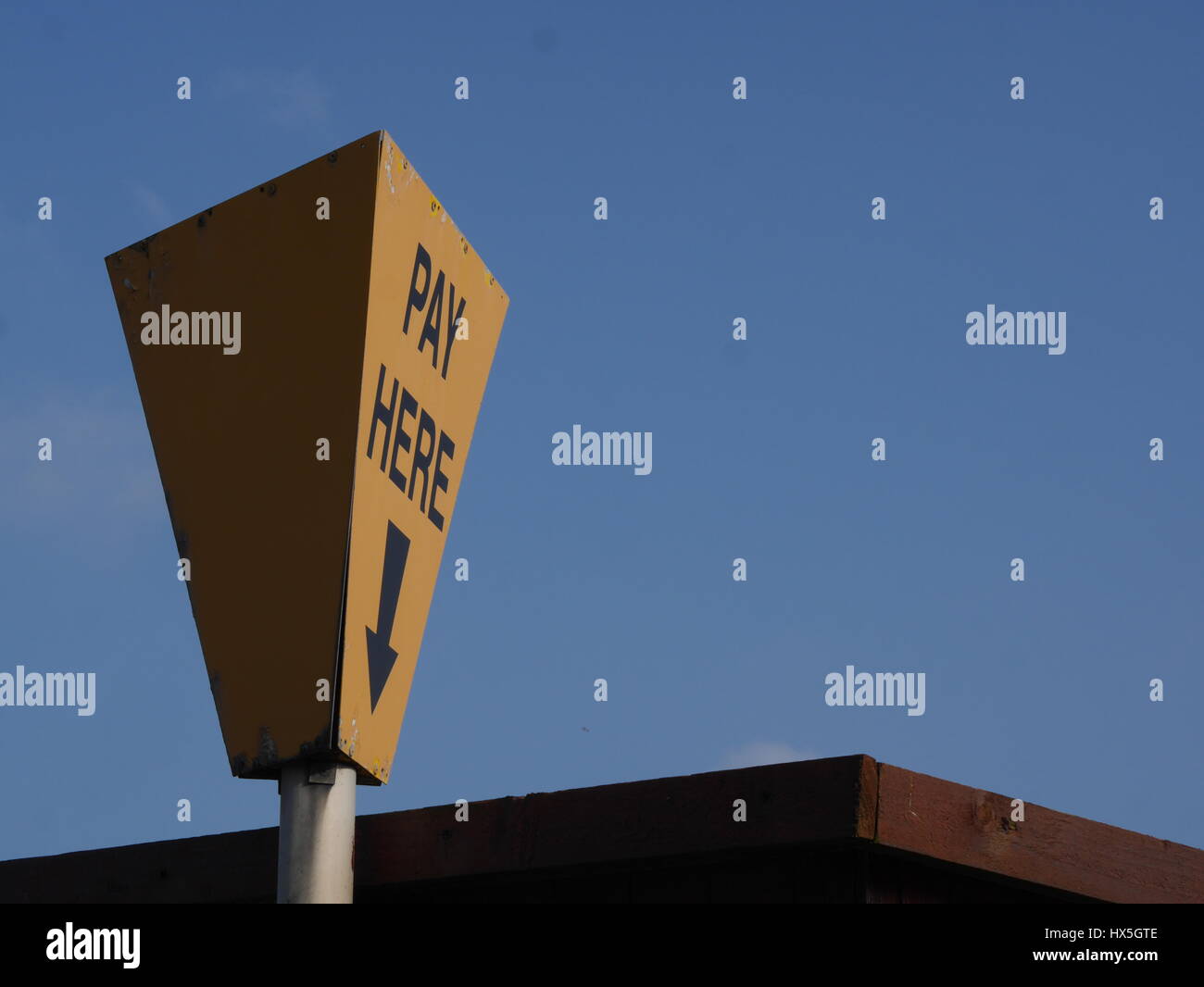 Pay Here sign Stock Photo - Alamy
