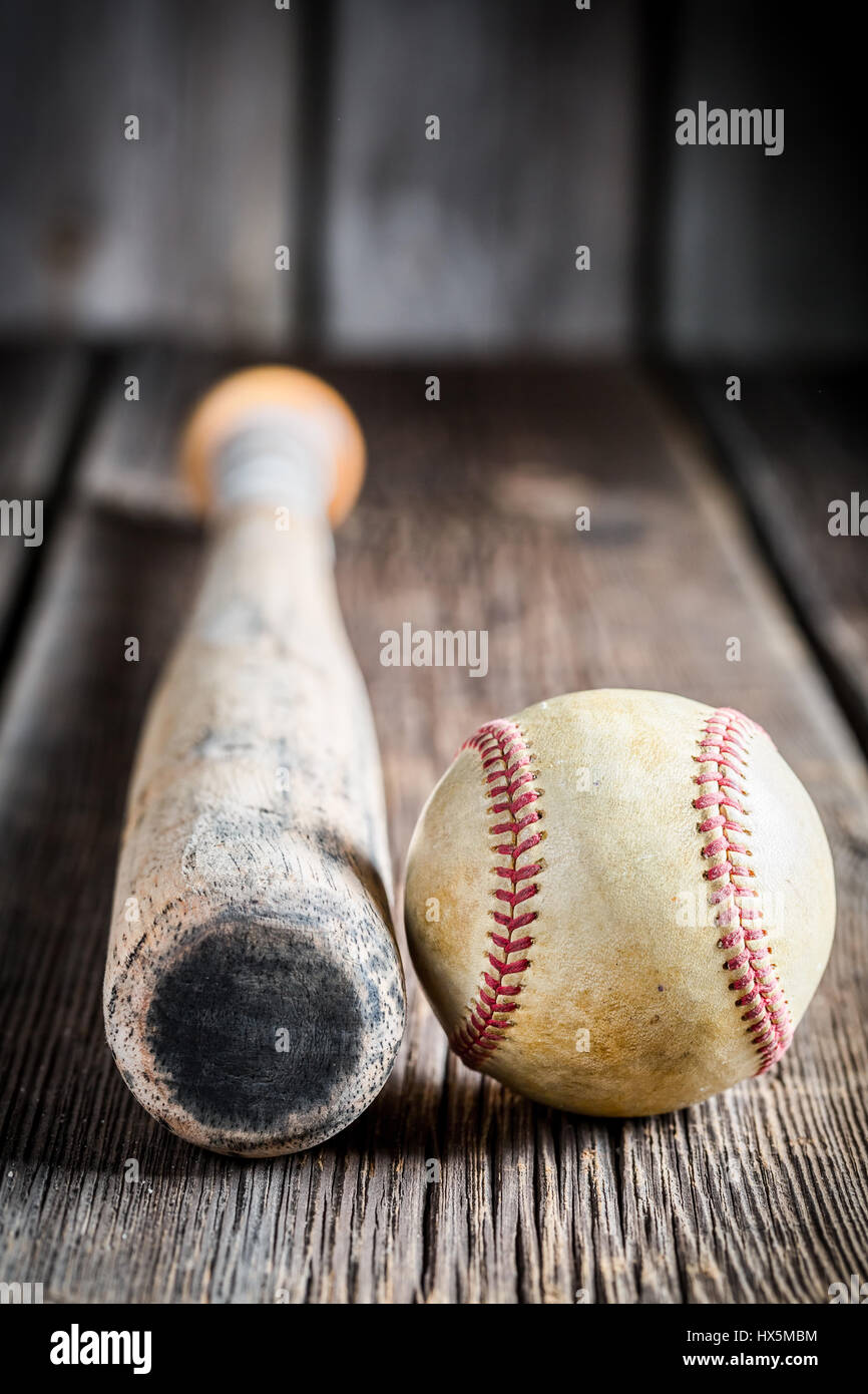 Old baseball bat and Ball on old wooden table Stock Photo - Alamy