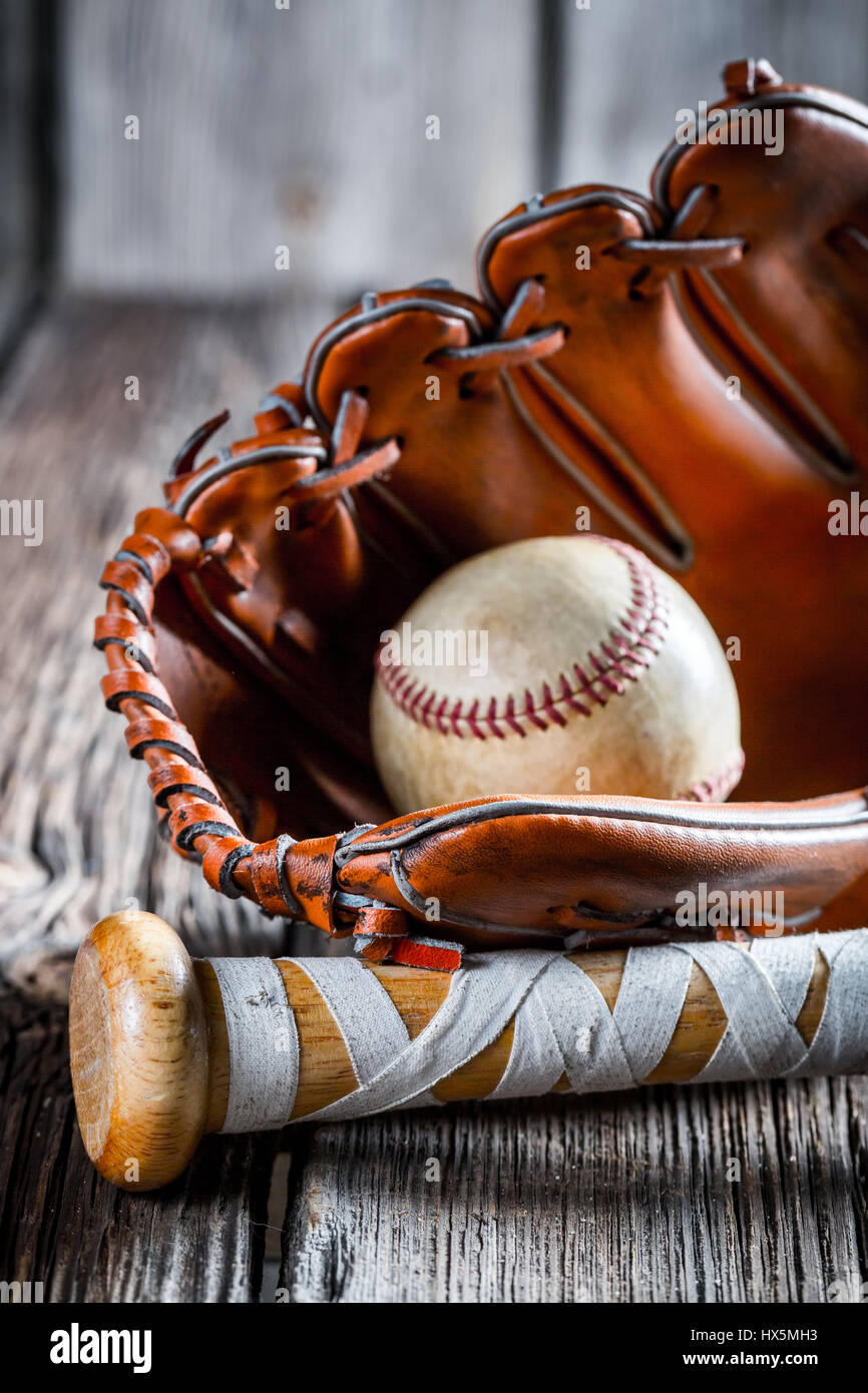 Old baseball bat and glove with ball Stock Photo - Alamy