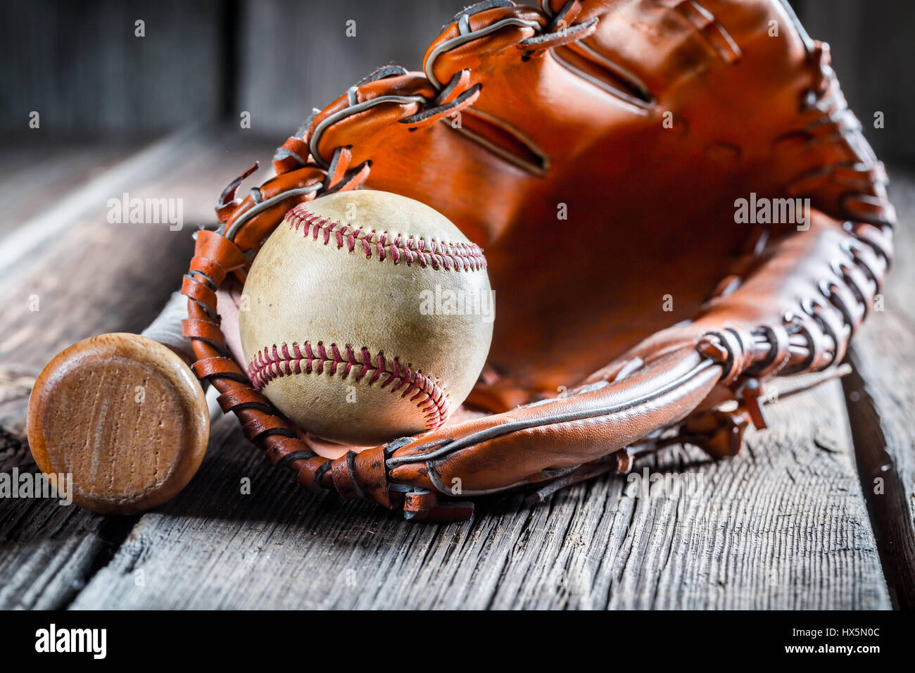 Vintage baseball bat and Ball on old wooden table Stock Photo - Alamy