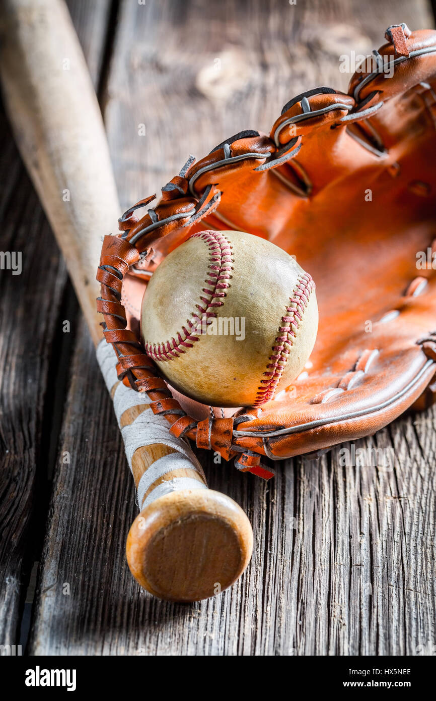 Vintage Baseball bat and ball on old wooden table Stock Photo - Alamy