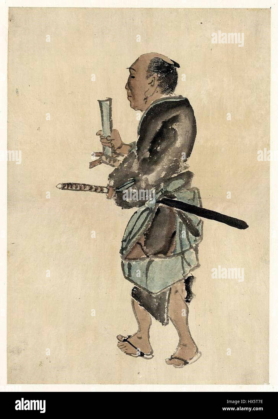 Man with a sword walking toward the left Stock Photo - Alamy