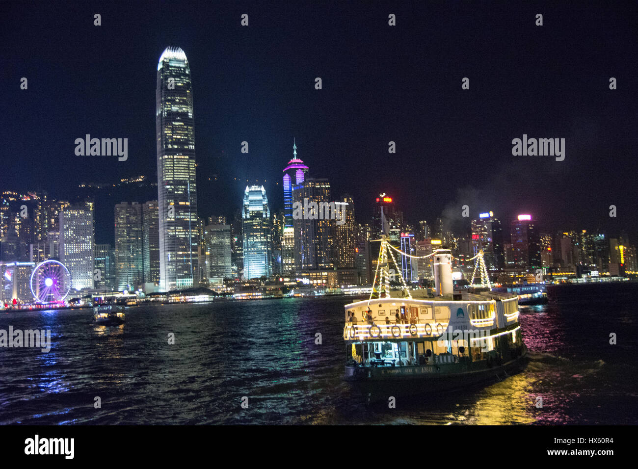 The illuminated Star Ferry travels along Victoria Harbour with the Hong ...