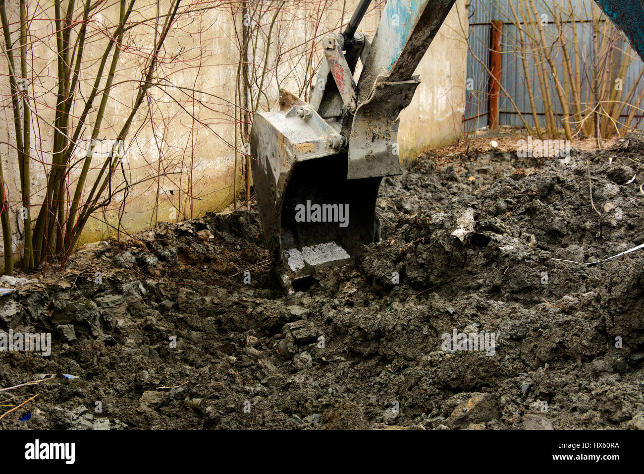 An old Soviet tractor digs and loads waste stone processing near the ...