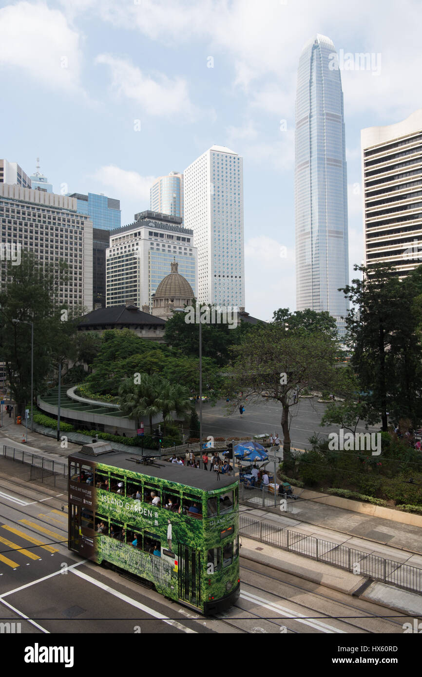 A double deck tram heads towards the Central district of Hong Kong. The ...